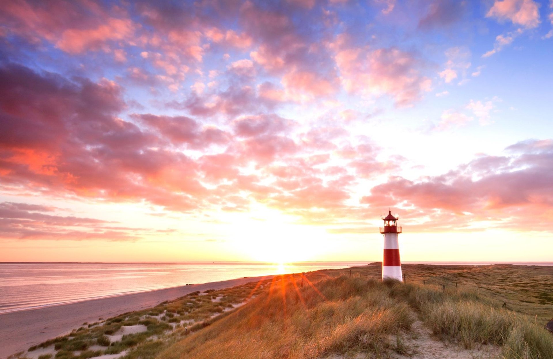 Radiant Sunrise Over Coastal Lighthouse HD Wallpaper