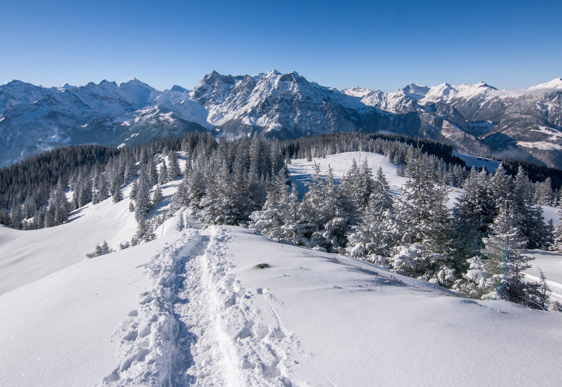 Majestic Snowy Alps of Switzerland: Winter Wonderland HD Wallpaper