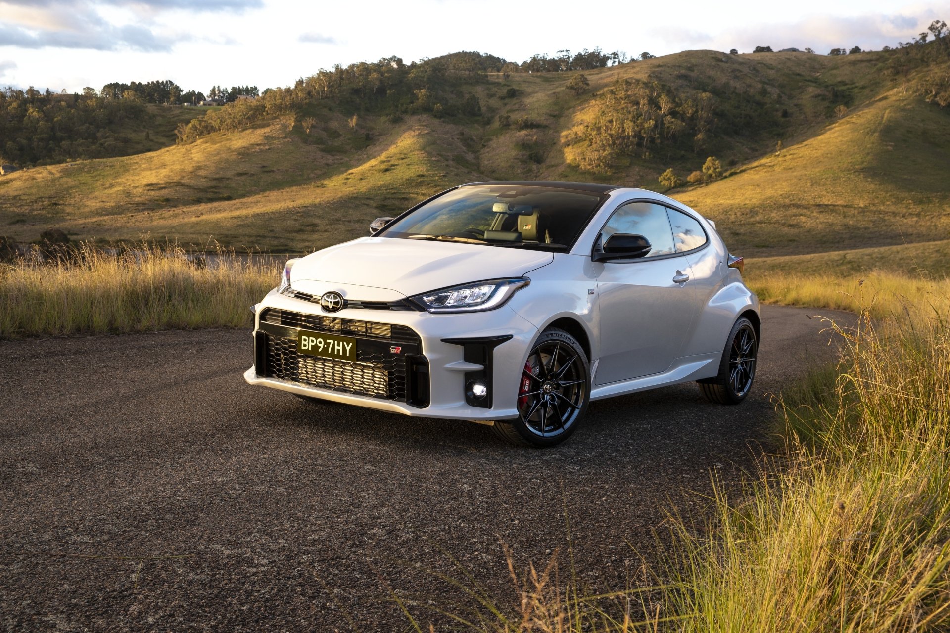 Download Compact Car White Car Car Toyota Vehicle Toyota Yaris HD Wallpaper