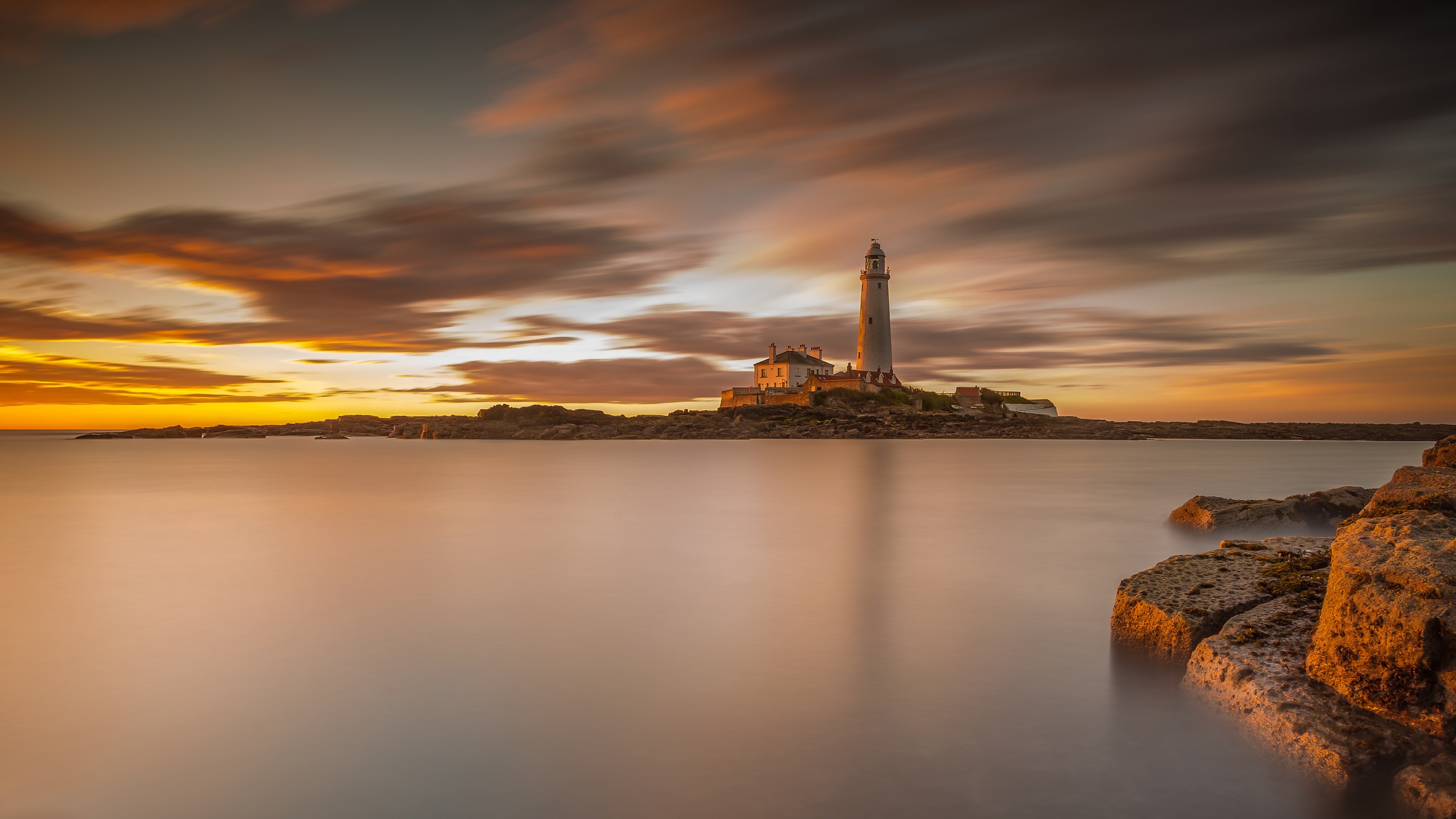 4K Ultra HD Lighthouse at Sunset: Man-Made Beacon Over Tranquil Waters