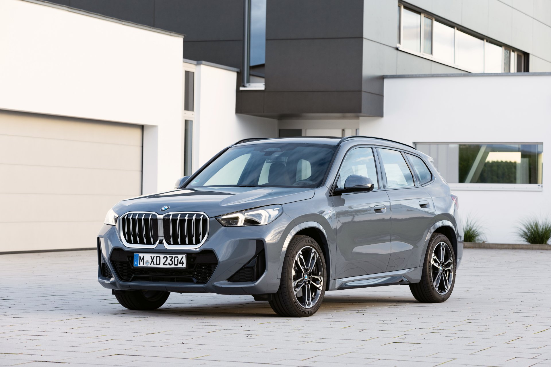 Download Vehicle BMW X1 8k Ultra HD Wallpaper