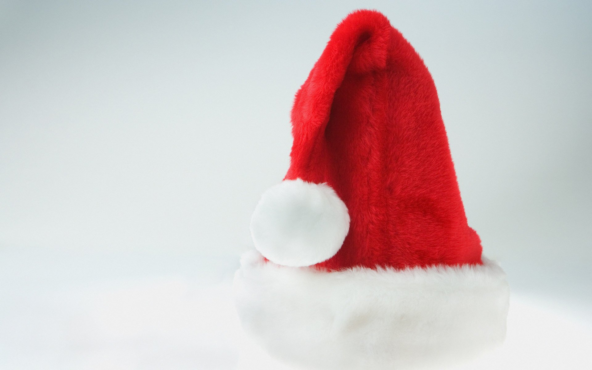 Festive Holiday Cheer: HD Santa Hat Christmas Wallpaper
