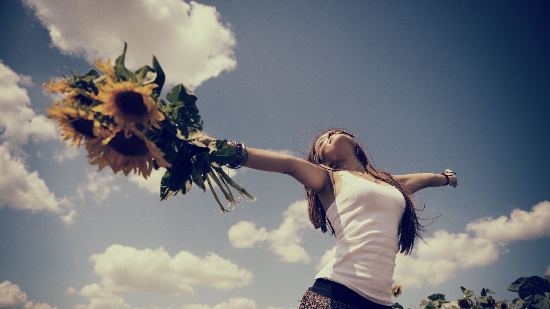 Radiant Freedom: HD Woman’s Mood in Blooming Sunflowers