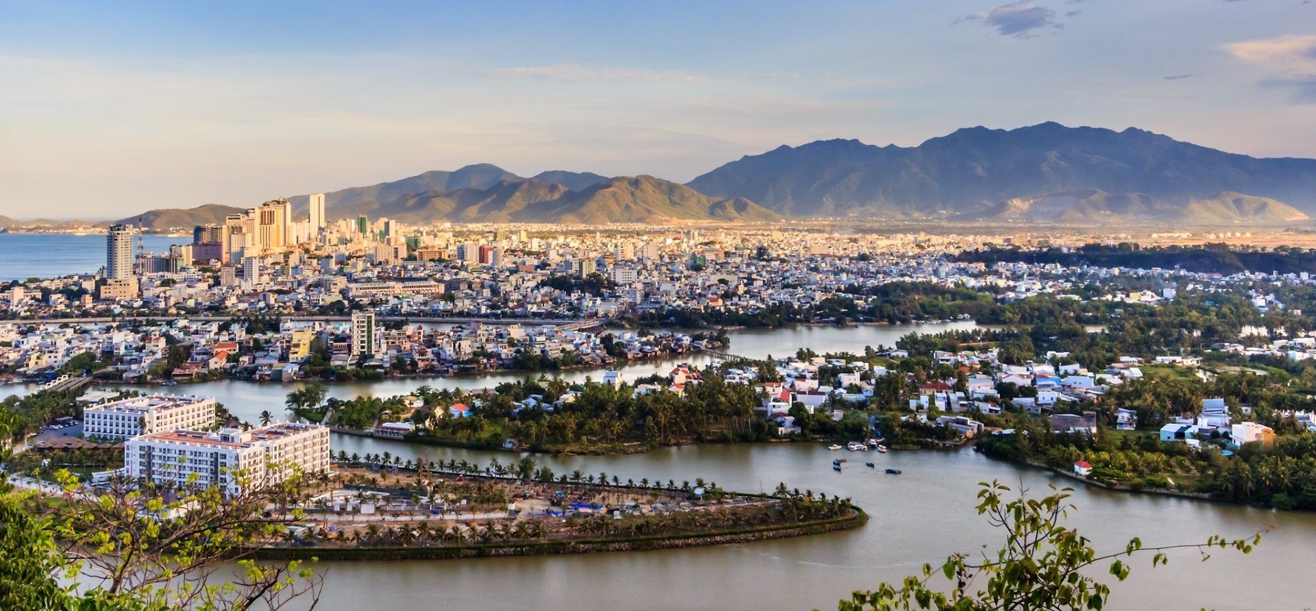 Vietnam Cityscape: Riverside Buildings and Mountain Views HD Wallpaper ...