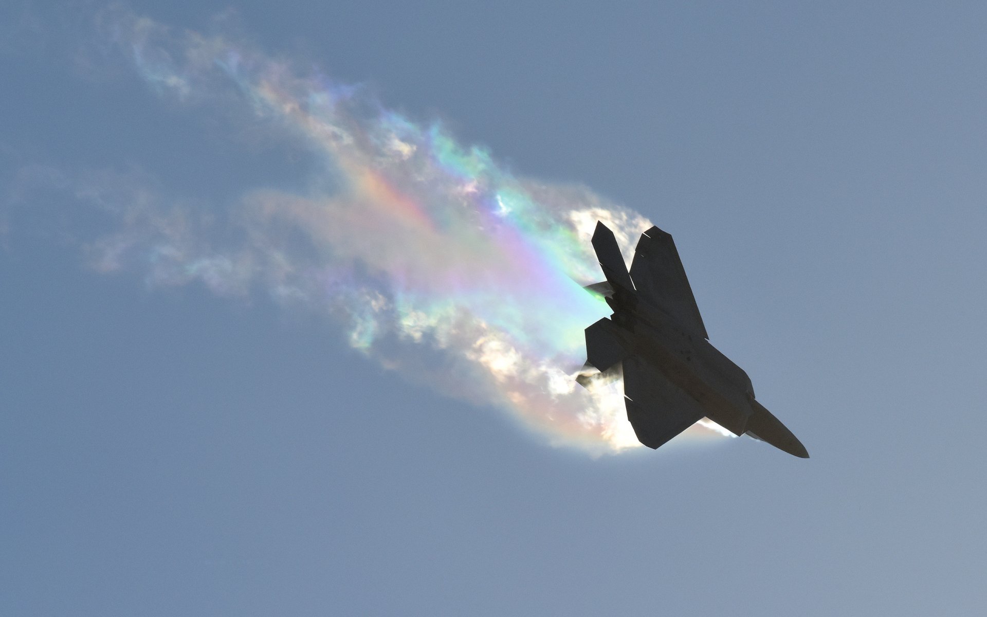 F-22 Raptor Warplane in Action: Majestic Smoke Trails HD Wallpaper