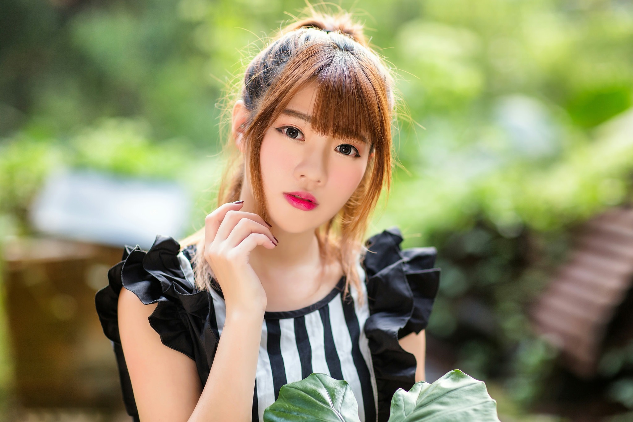 Radiant Asian Beauty: Brunette Model with Bold Lipstick in Stunning ...