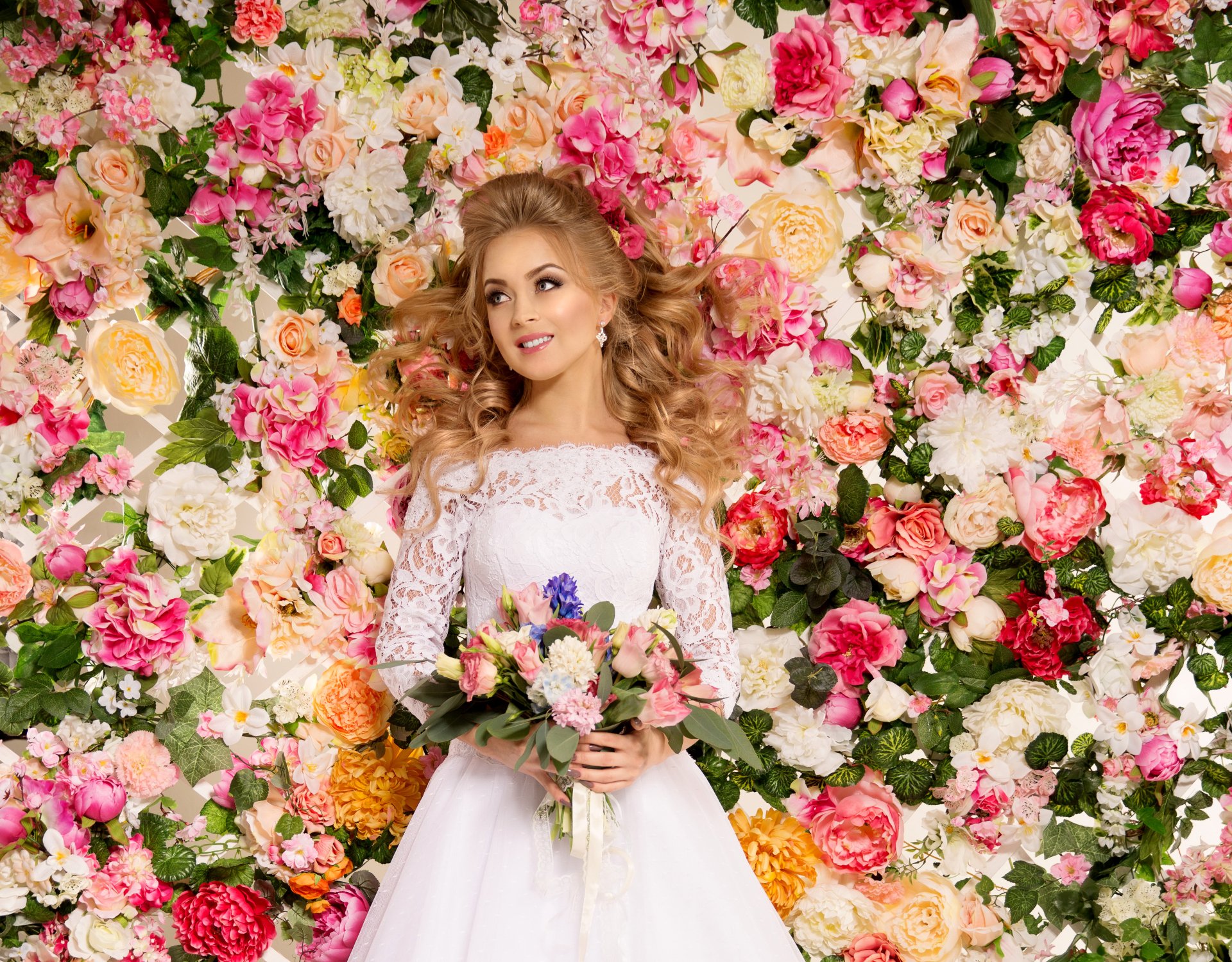 Smiling Blonde Bride Against Blooming Wall — 4K Wedding Wallpaper