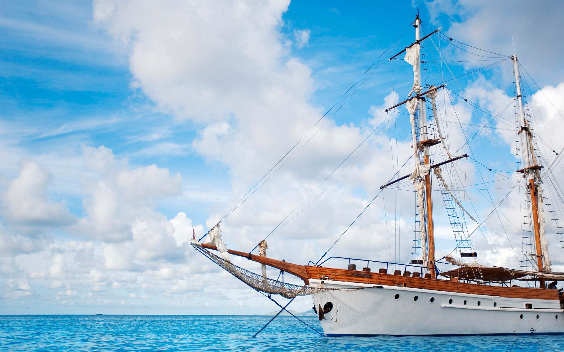 Sailing Serenity: HD Ship Wallpaper on Calm Blue Waters