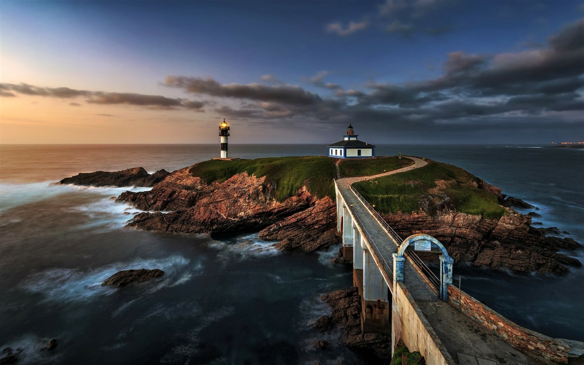Sunset Horizon: Ocean Walkway to the Island Lighthouse HD Wallpaper